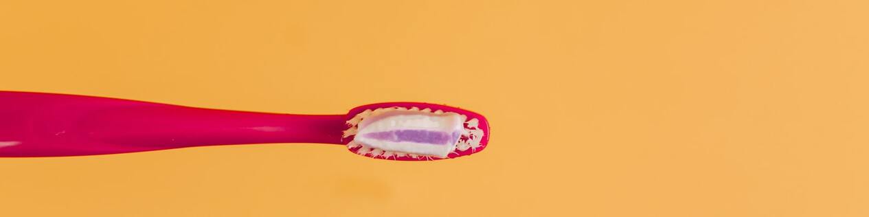 Red Toothbrush With Toothpaste In Yellow Background - LinkedIn ...