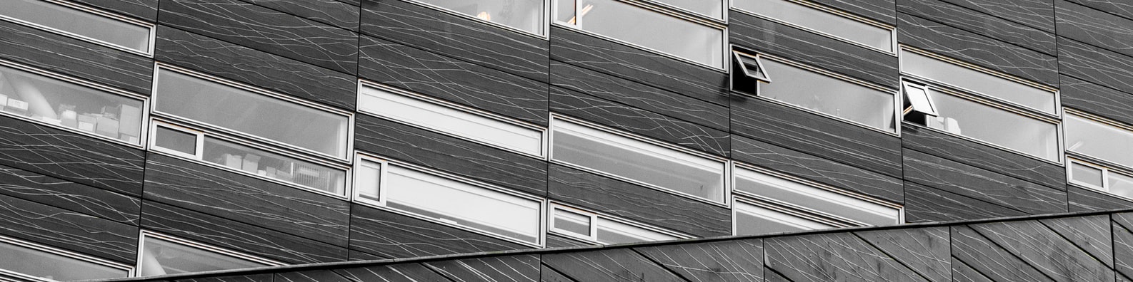 Gray Brick Building With Glass Windows - LinkedIn Background - Get some ...